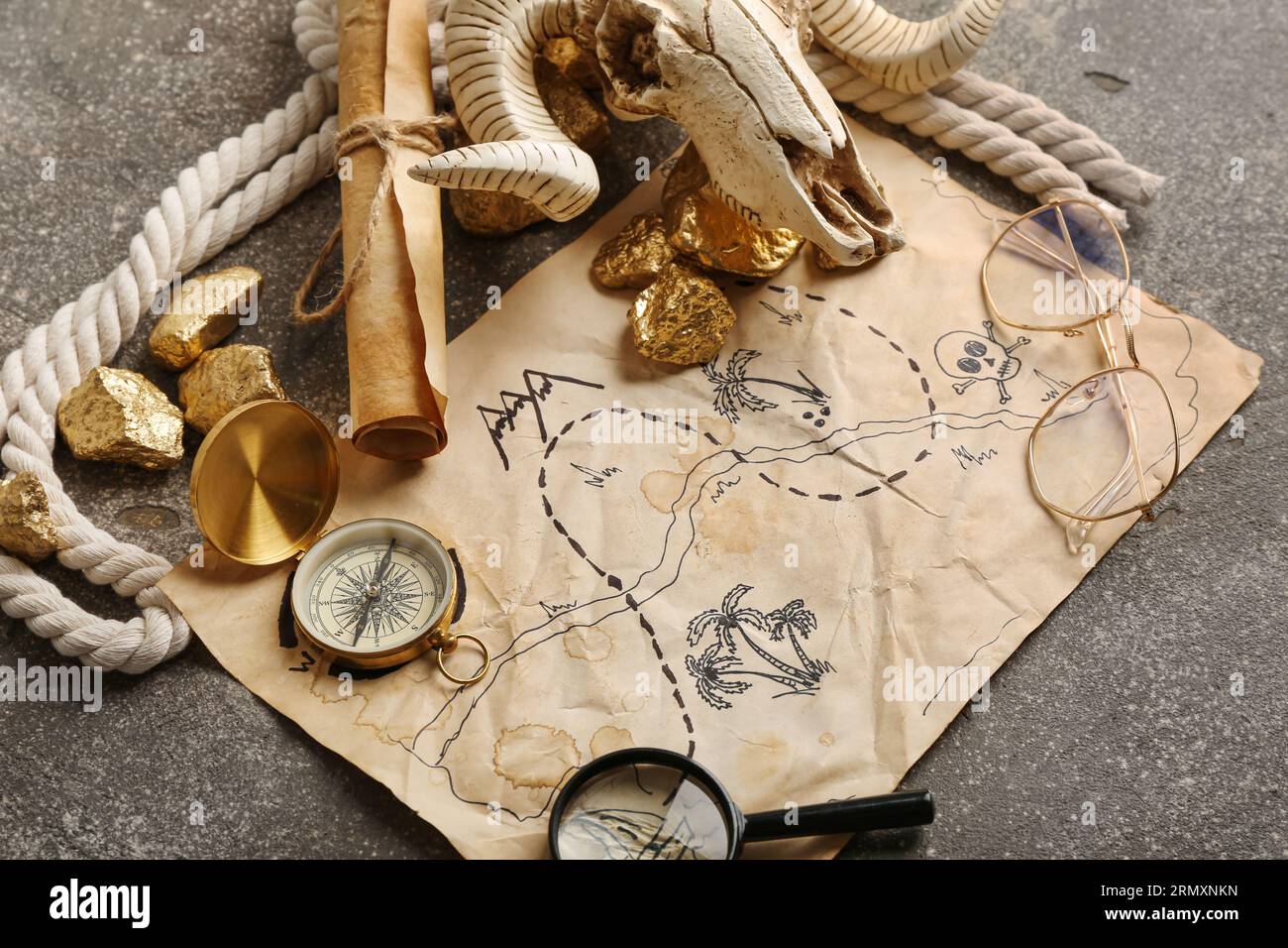 Sheep scull with travel equipment, scroll and golden nuggets on grunge ...