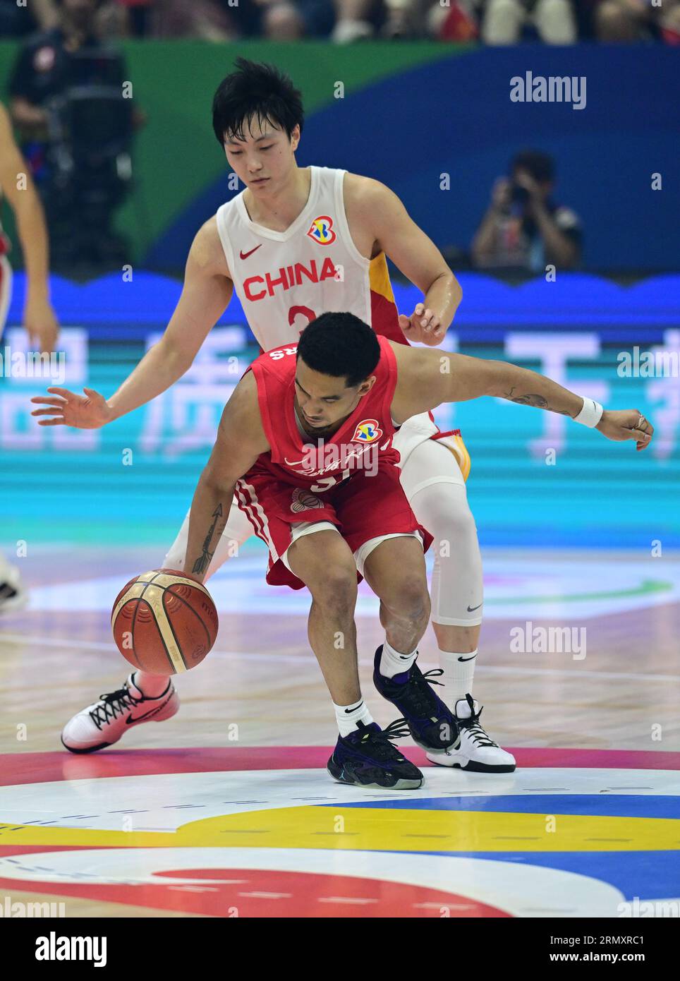Quezon City, Philippines. 30th Aug, 2023. Mingxuan Hu (back) of China men basketball team and ...