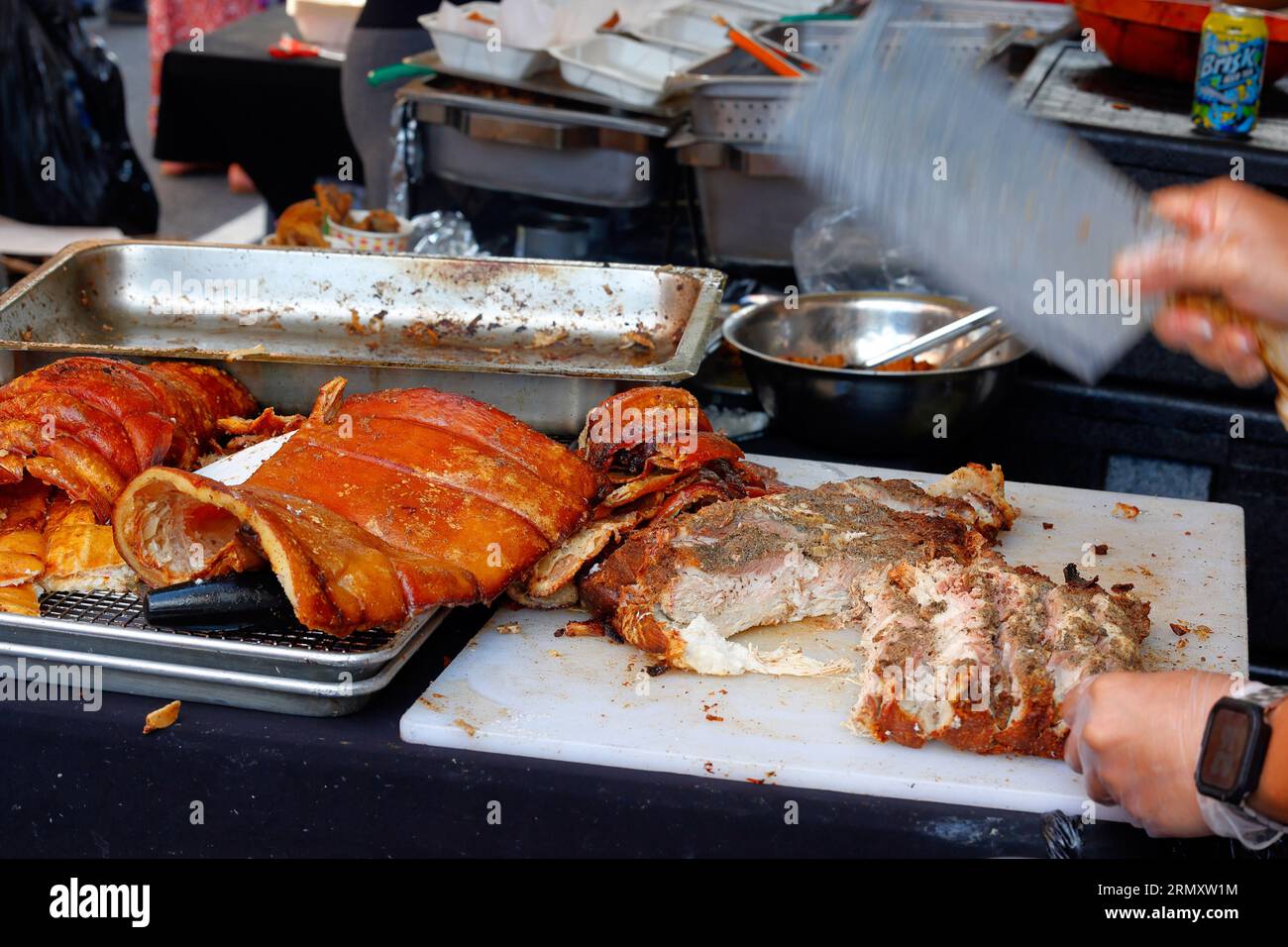A Patok by Rach worker prepare lechon at Philippines Fest food festival ...