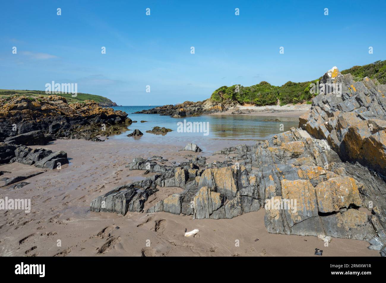 Dramatic rock formations on Angle Bay beach in South Wales Stock Photo ...