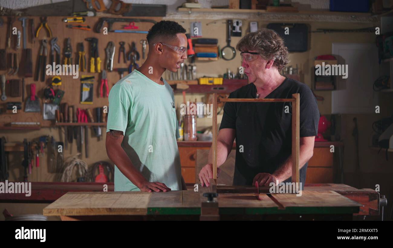 Master carpenter and Employee at Carpentry Workshop, People Engaged in ...