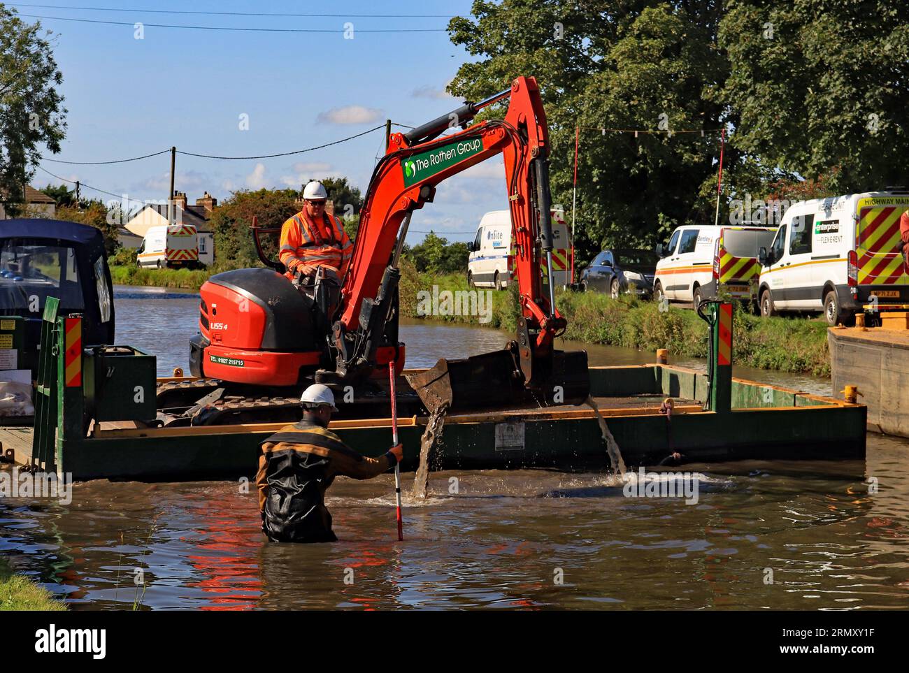 Floating dredging machinery at work digging out stones and silt from ...