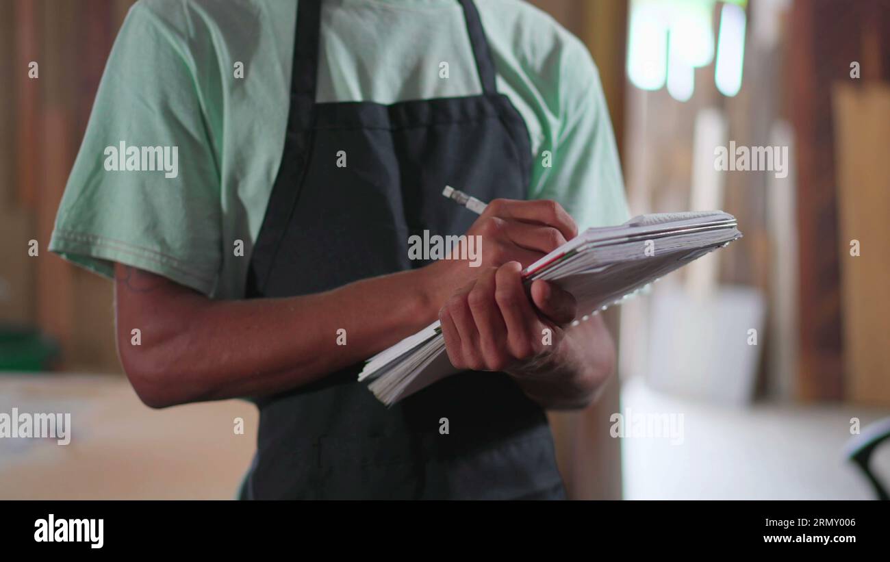 One Young Black Brazilian Apprentice of Carpentry Workshop Taking Notes ...