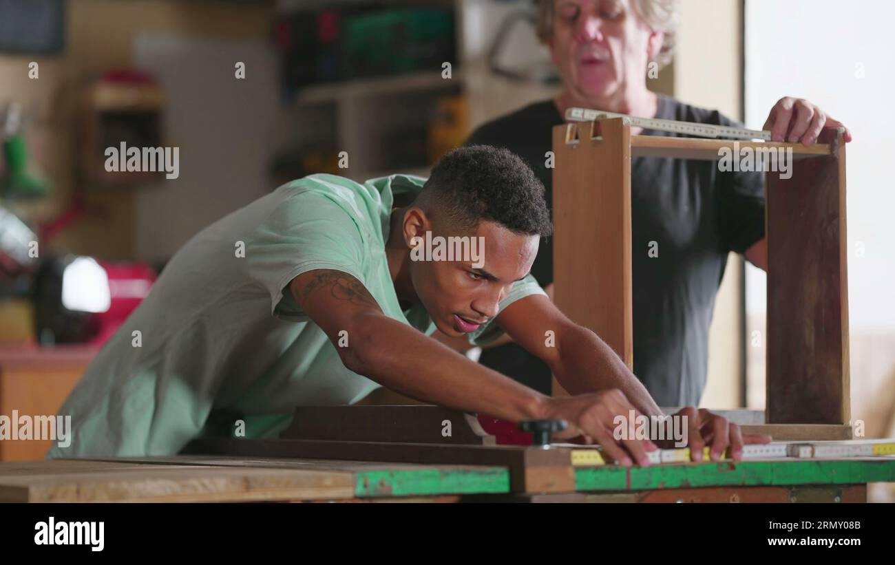 Candid scene carpenters working hi-res stock photography and images - Alamy