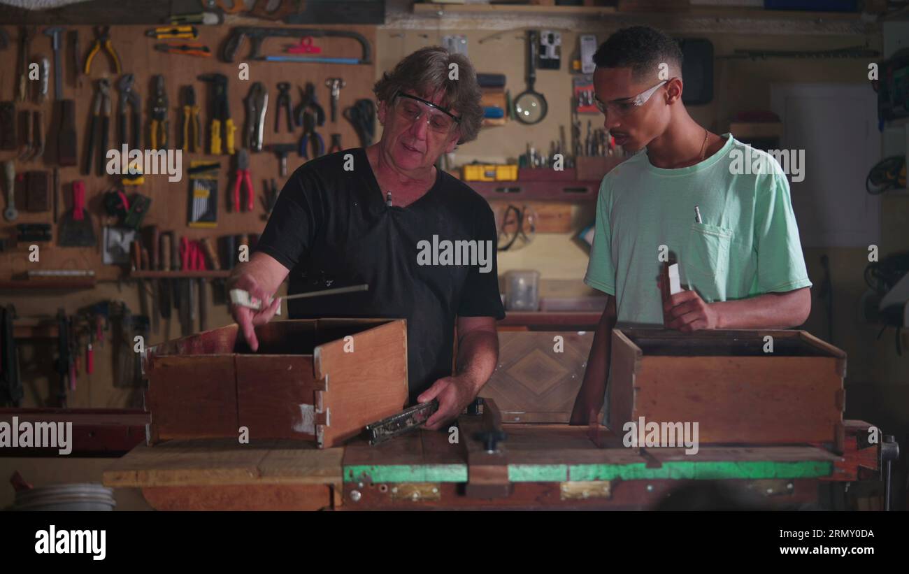 Carpentry Workshop of Master Carpenter and Apprentice Measuring Wood ...