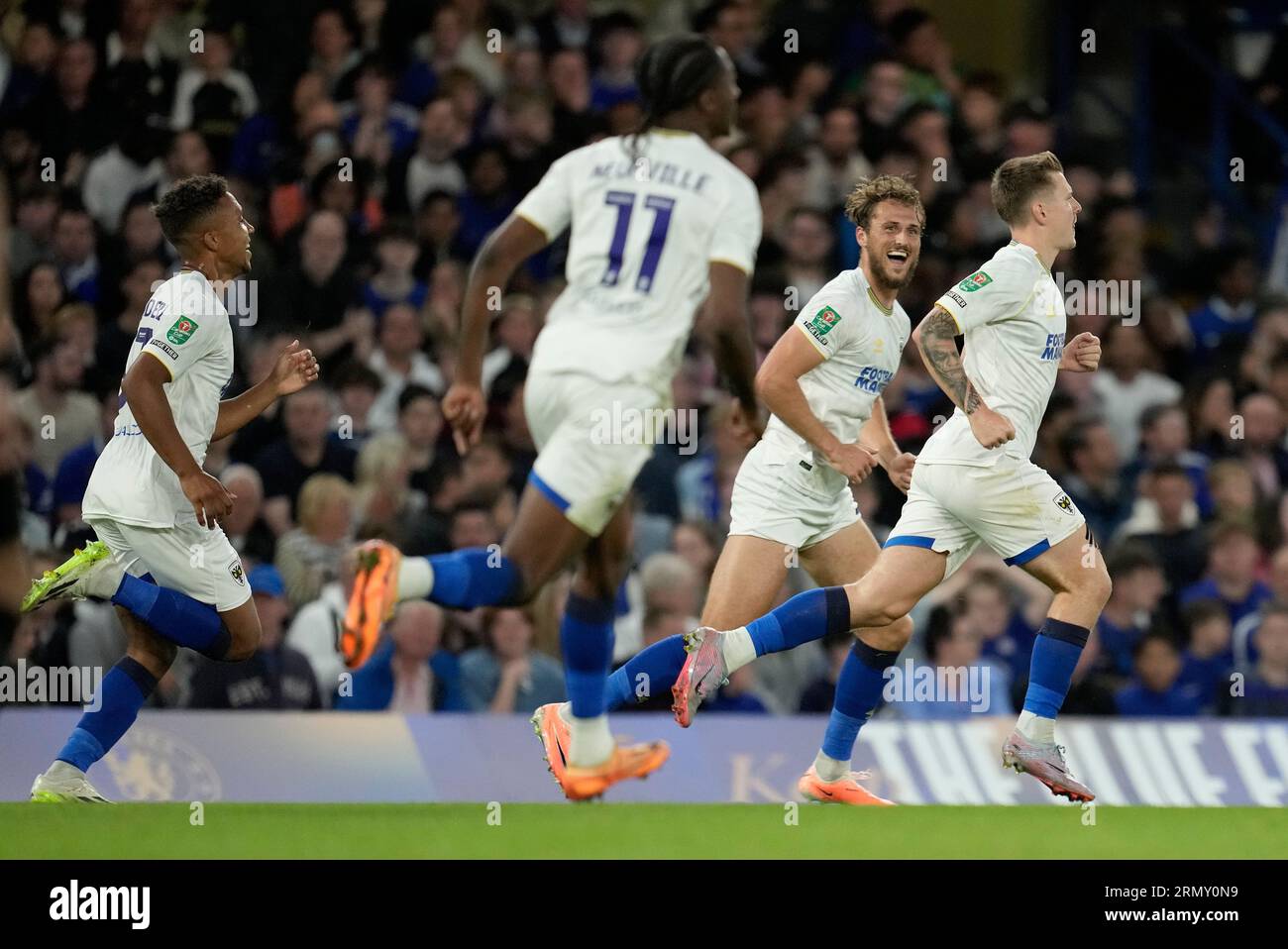 AFC Wimbledon's James Tilley, right, celebrates scoring the opening ...