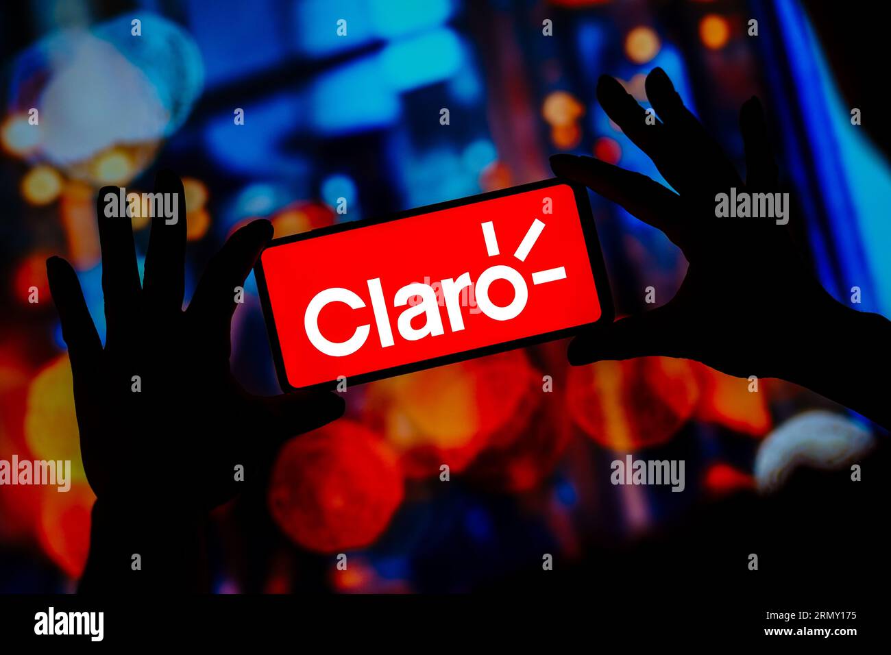In this photo illustration, the Claro logo is displayed on a smartphone ...