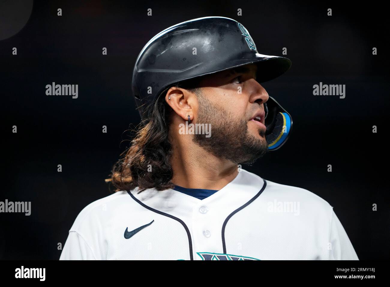 Seattle Mariners' Eugenio Suarez looks on after an out in a baseball ...