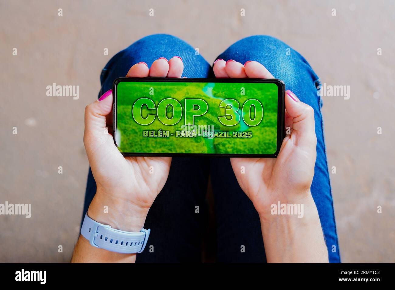 In this photo illustration, the 2025 United Nations Climate Change ...