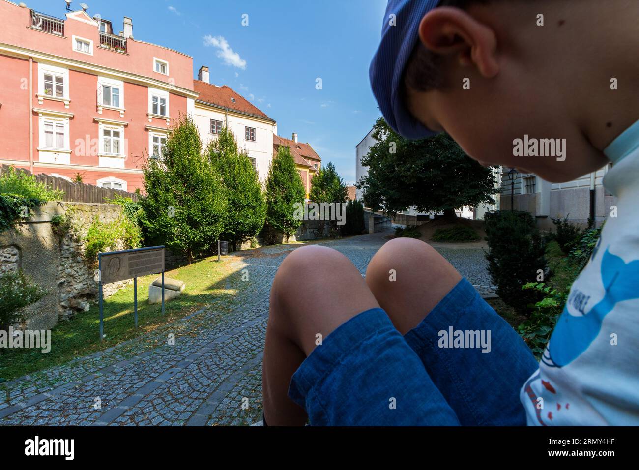 Baroque houses of Elokapu with former moat. Child climbing on town wall ...