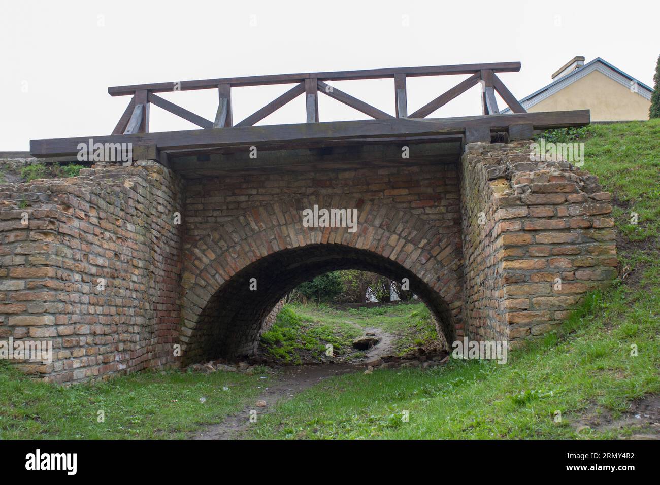 old brick bridge restored entrance to the castle Stock Photo - Alamy
