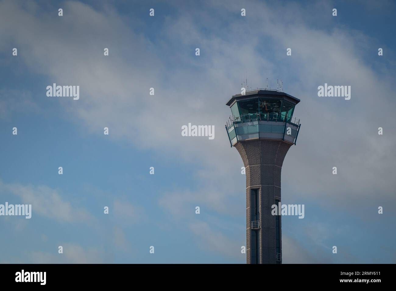 Luton airport in London control tower isolated on blue sky with some ...