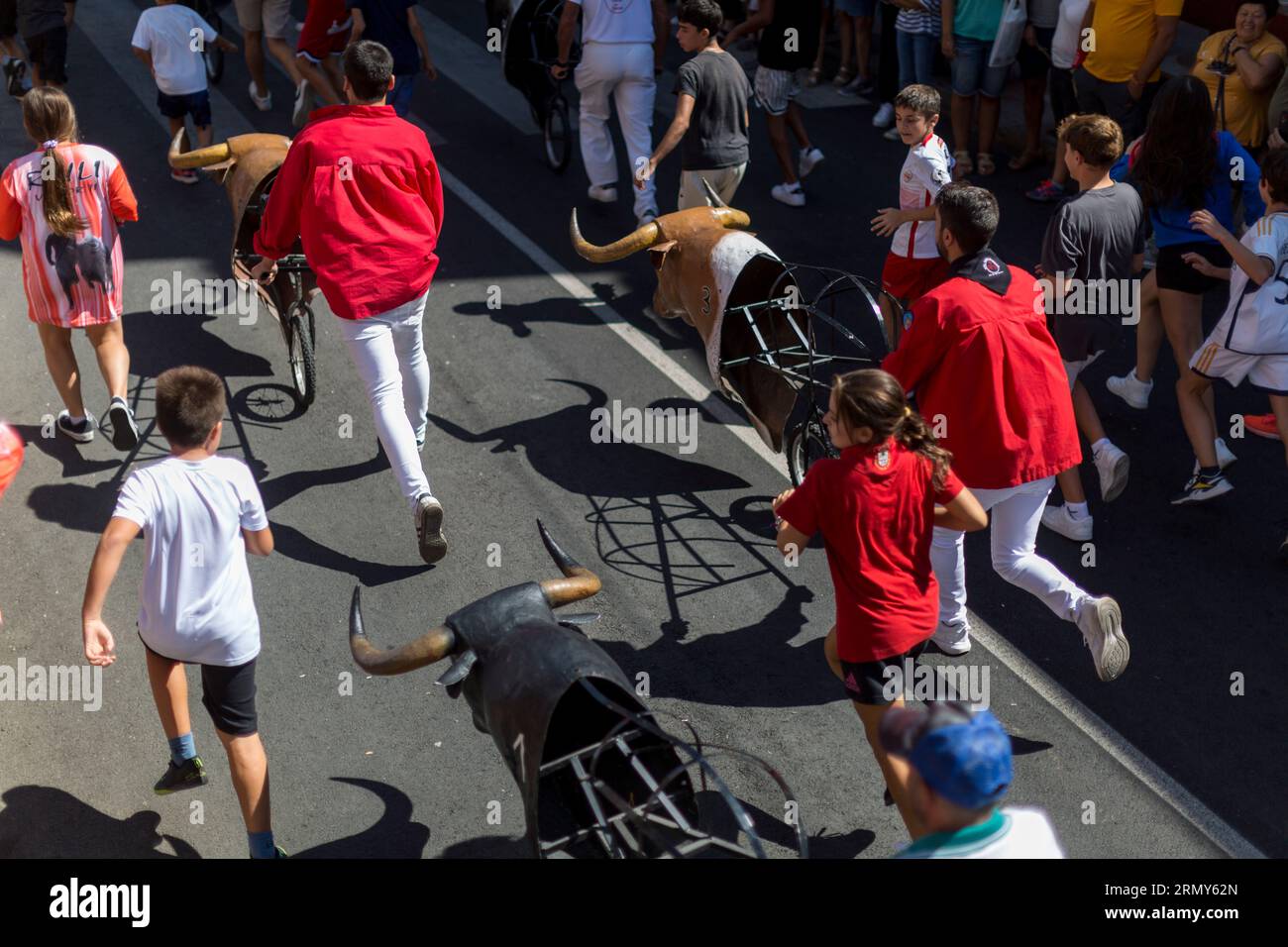 Children running bulls hi-res stock photography and images - Alamy