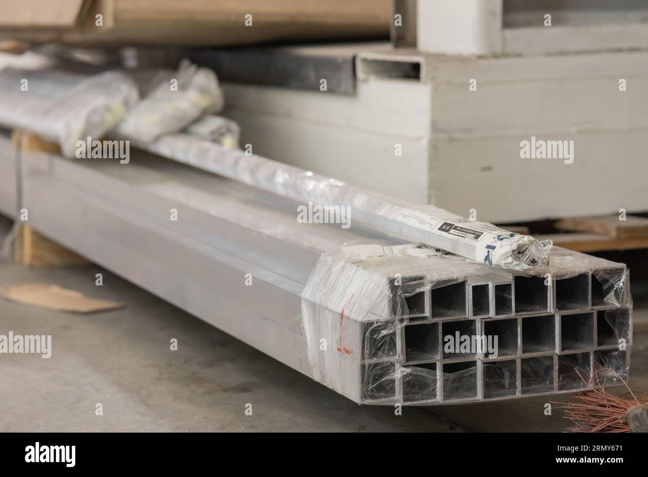 A lot or bunch of aluminium profiles bound together, destined for laser ...