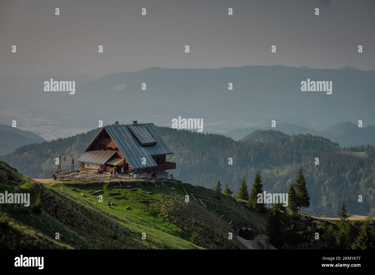 Beautiful alpine hut on Golica mountain visible from above. Nice forest ...