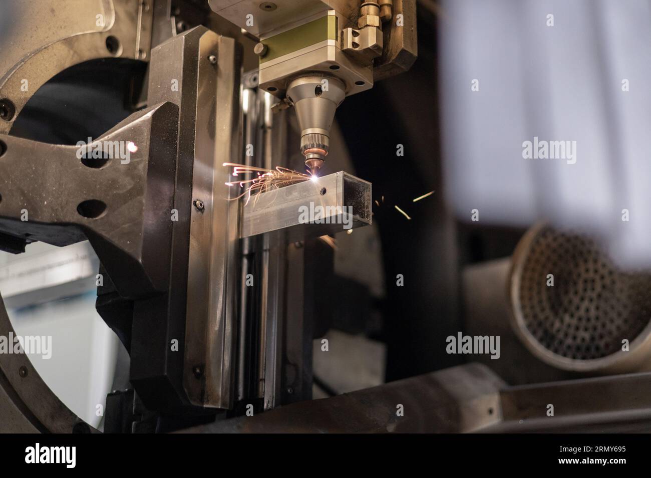 Detail of laser plasma cutter in operation when cutting and drilling ...