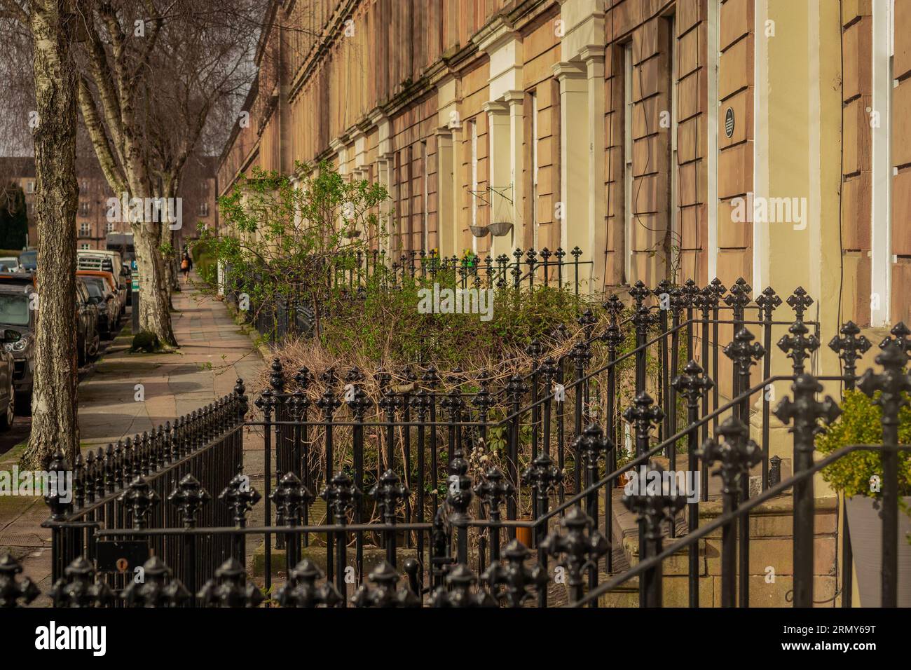 Typical street in the suburb of Glasgow, a row of older type houses ...