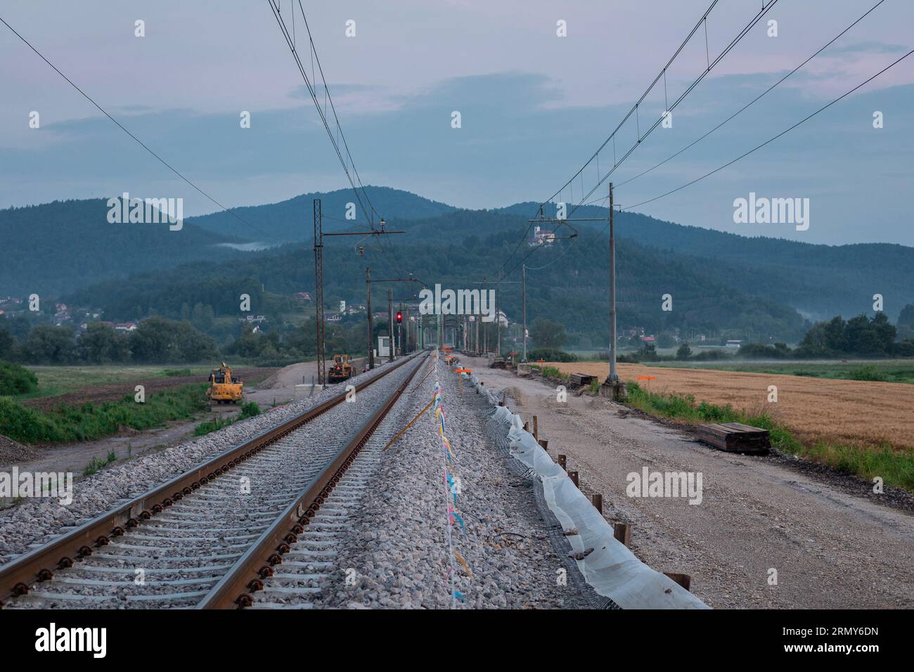 Train track renovation. Twin rail tracks of which one is dismantled ...