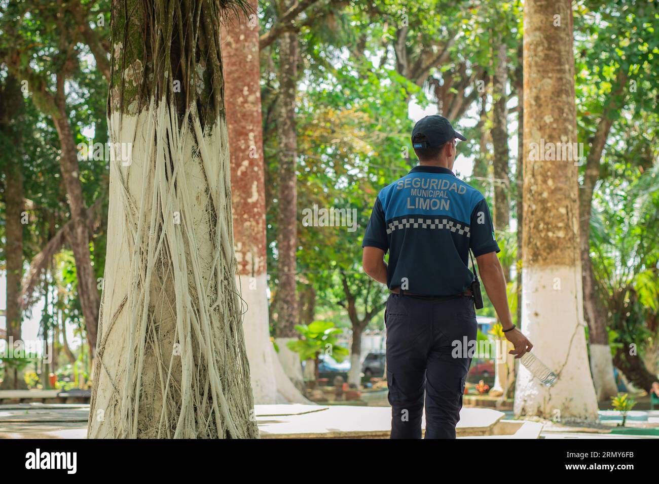Unknown policeman or security guard in the park in the city of Limon ...
