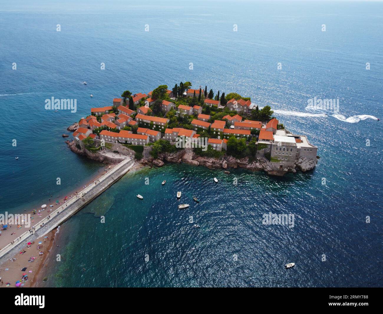 Aerial view of Sveti Stefan island and shore in a beautiful summer day ...