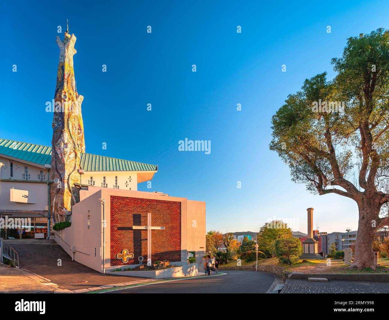 Nagasaki, Kyushu - Dec 11 2022: Sunset over St Filippo Nishizaka Church ... Nagasaki, Kyushu - Dec 11 2022: Sunset over St Filippo Nishizaka Church ...