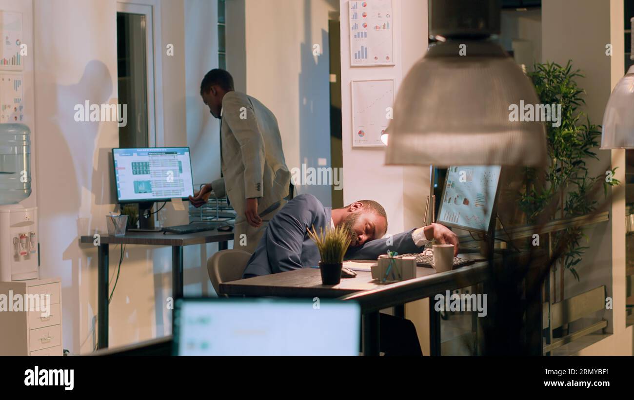 Employee finishing nightshift, preparing to leave workplace, catching ...