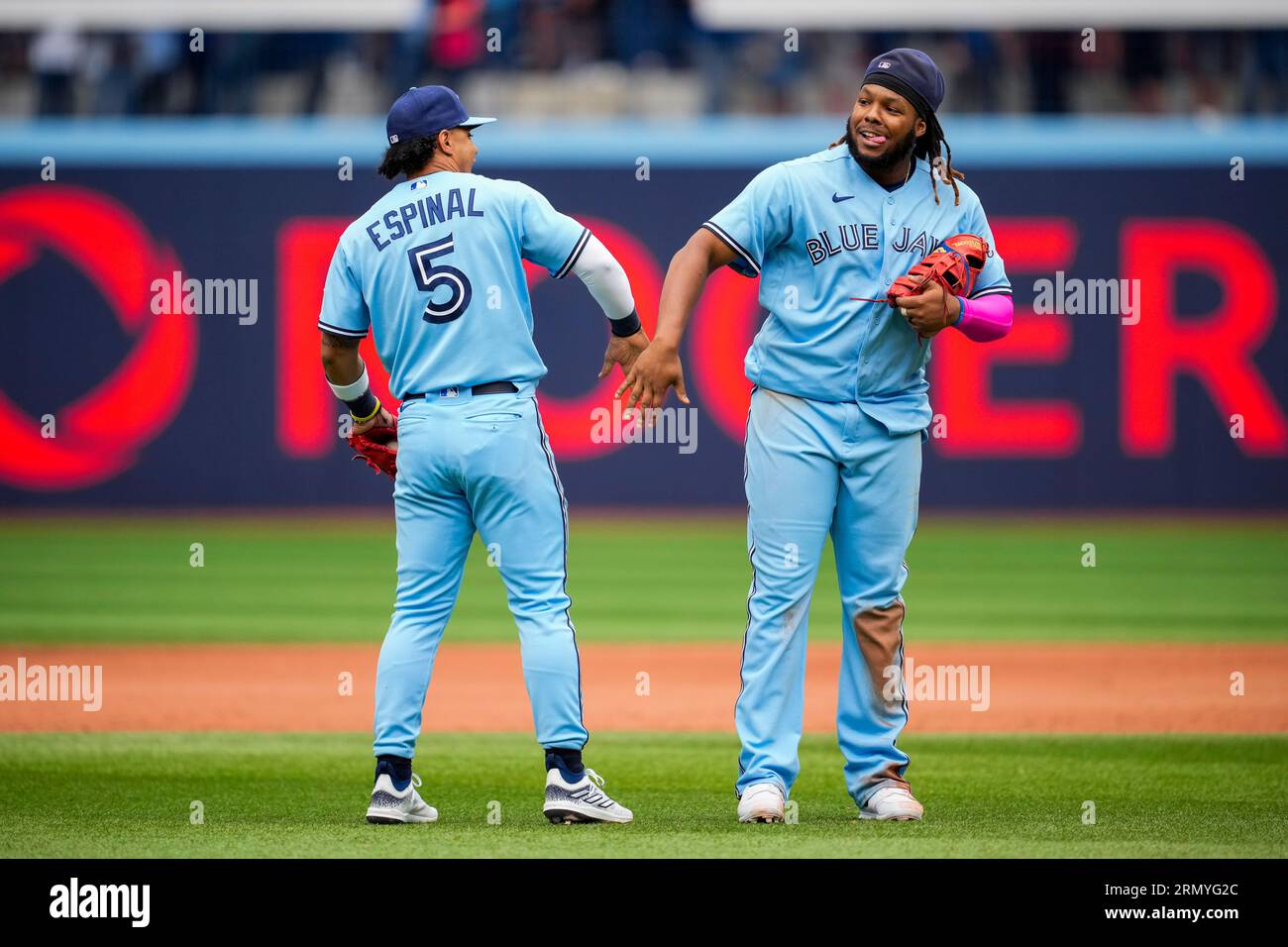 Toronto Blue Jays' Santiago Espinal (5) and Vladimir Guerrero Jr ...