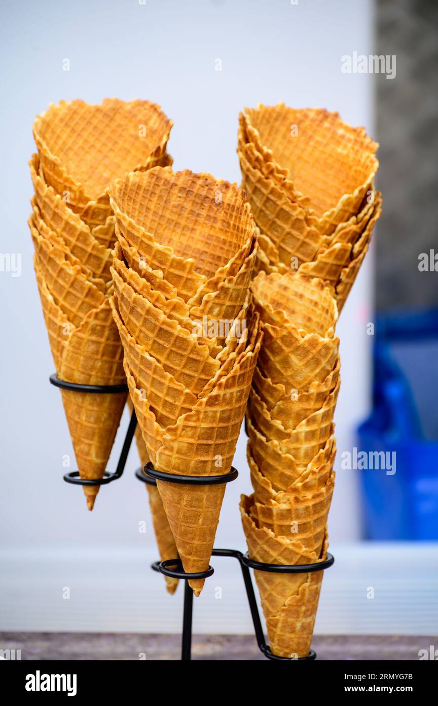 Fresh baked empty cones for ice cream, food background Stock Photo - Alamy