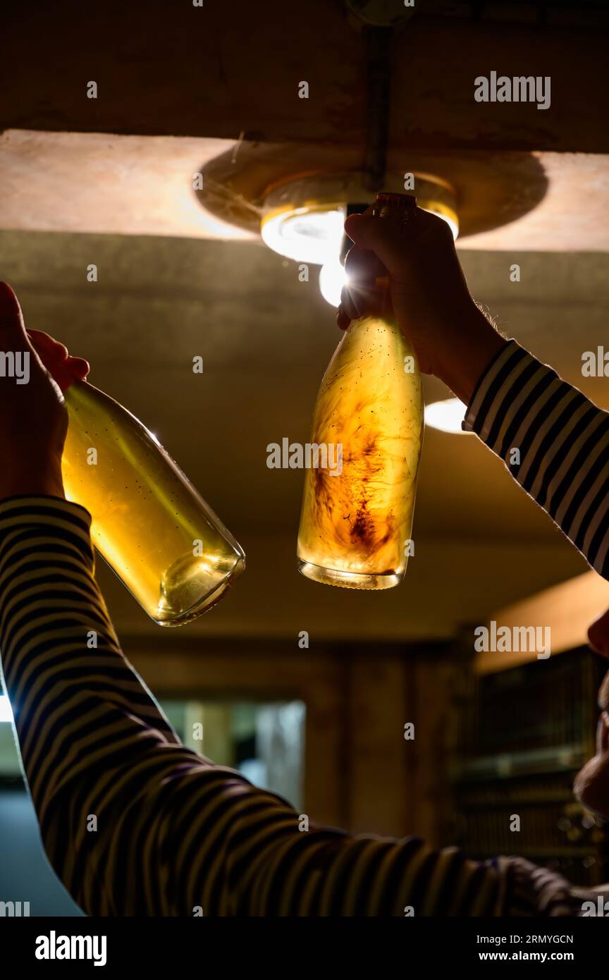 Visit of undergrounds caves, showing of sediment in bottle, traditional ...