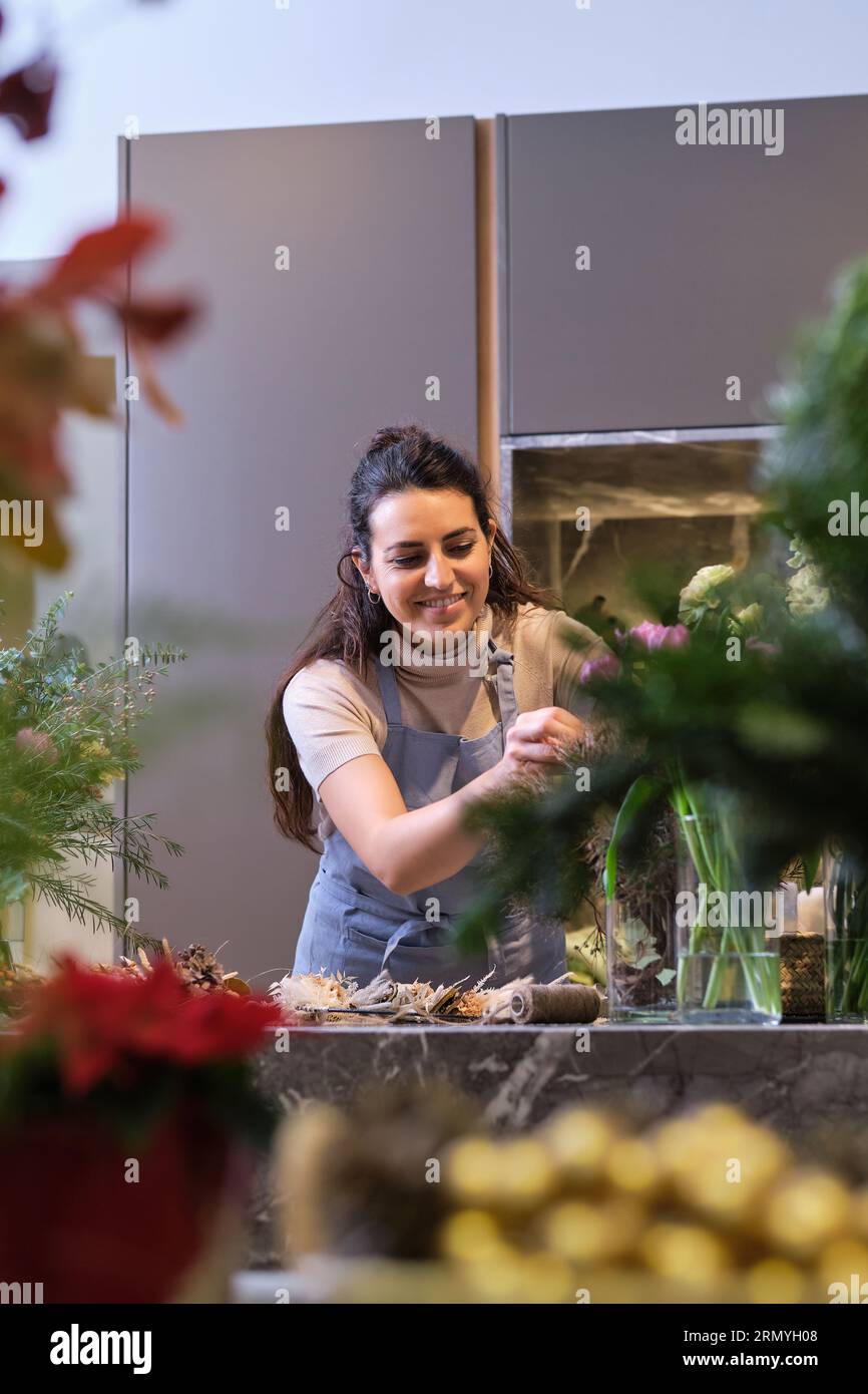 Female florist in uniform hi-res stock photography and images - Alamy