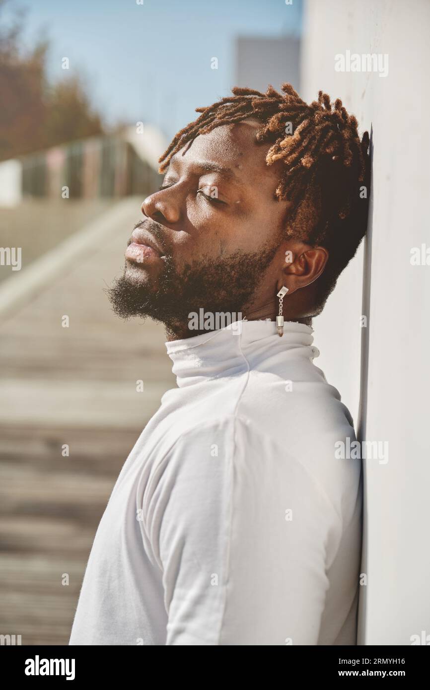 Side view portrait of pensive African American bearded man with ... Side view portrait of pensive African American bearded man with ...