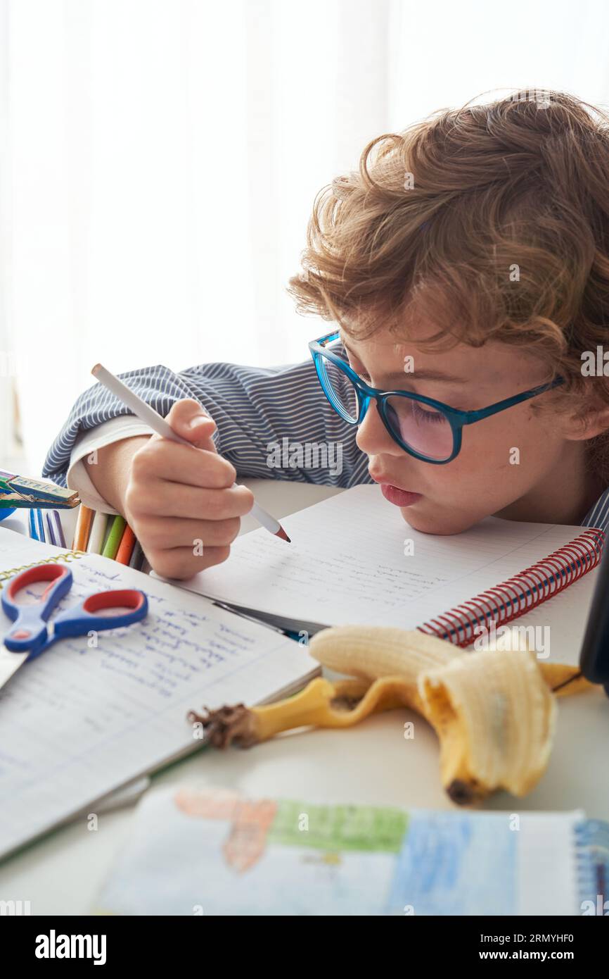 Concentrated schoolboy studying hi-res stock photography and images - Alamy