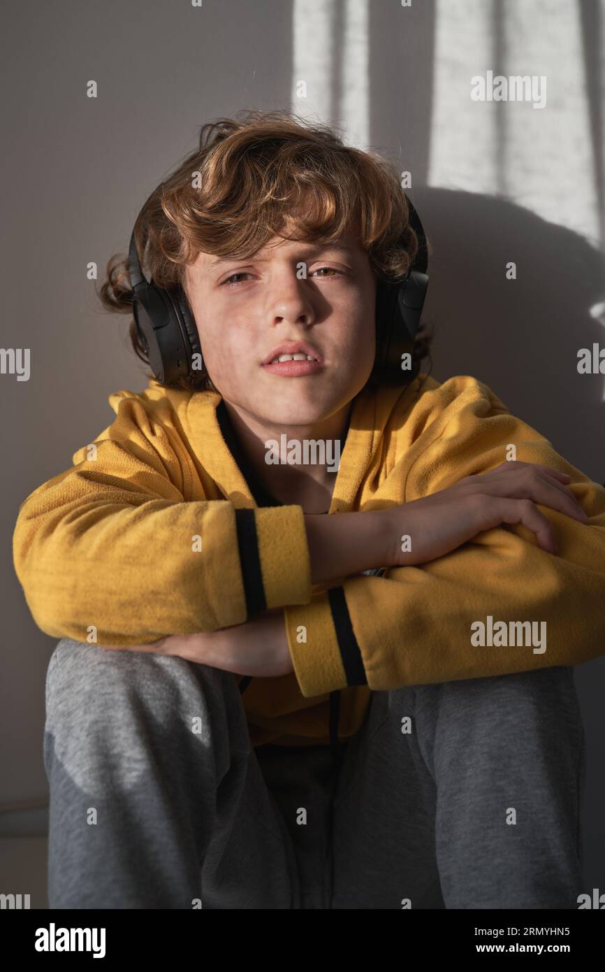 Sad boy sitting alone in hi-res stock photography and images - Alamy