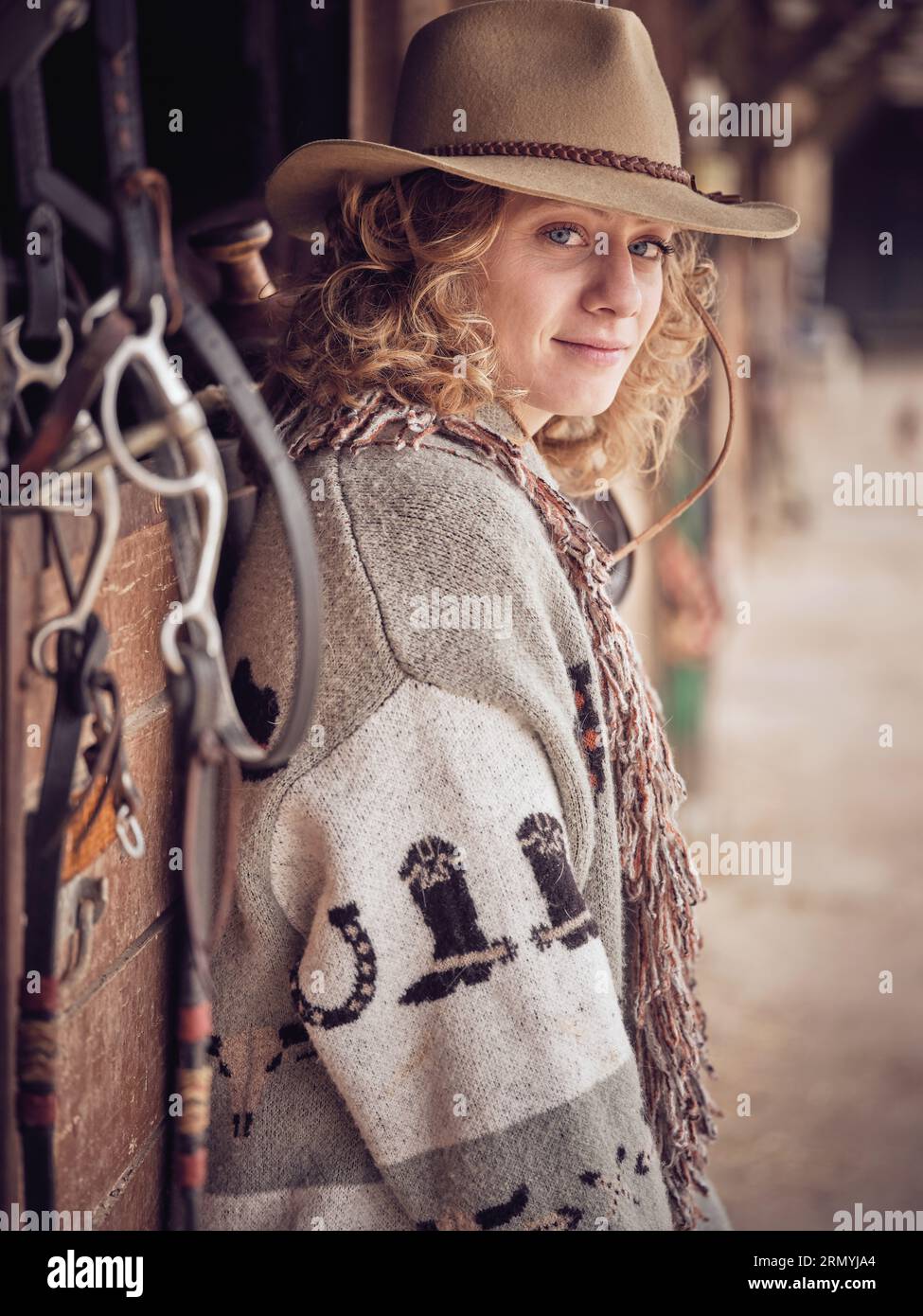 Side view lady with fair hair in cowgirl hat and Western cardigan ...