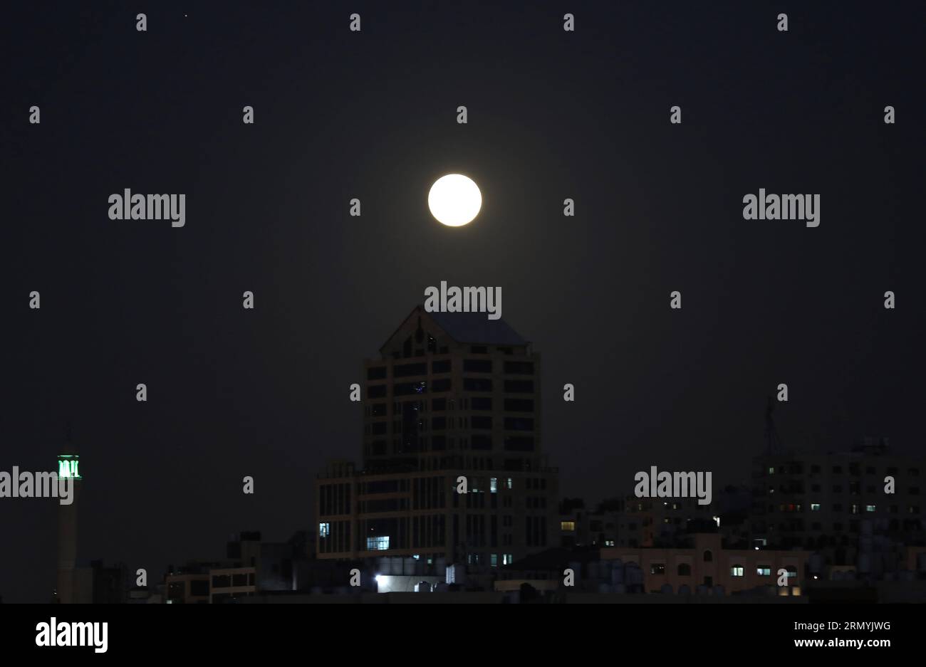 Nablus. 30th Aug, 2023. A full moon is seen in the sky over the West Bank city of Nablus, on Aug ...