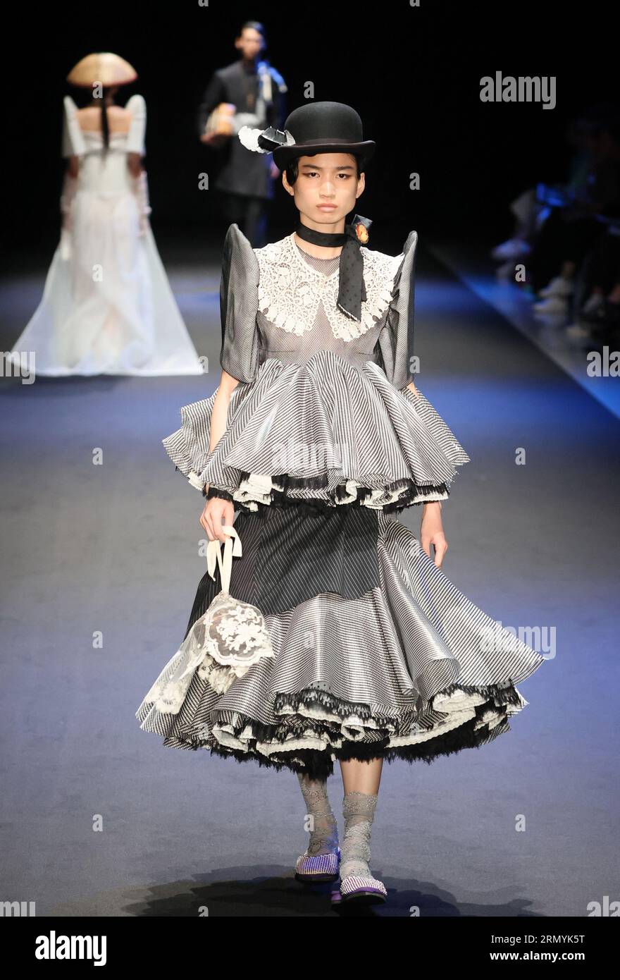 Tokyo, Japan. 30th Aug, 2023. A model displays a creation of "Bench ...