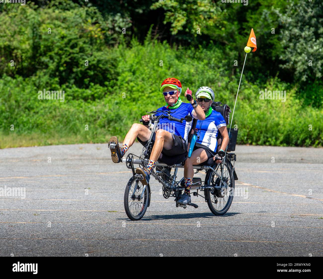 Man and woman riding tandem hi-res stock photography and images - Alamy