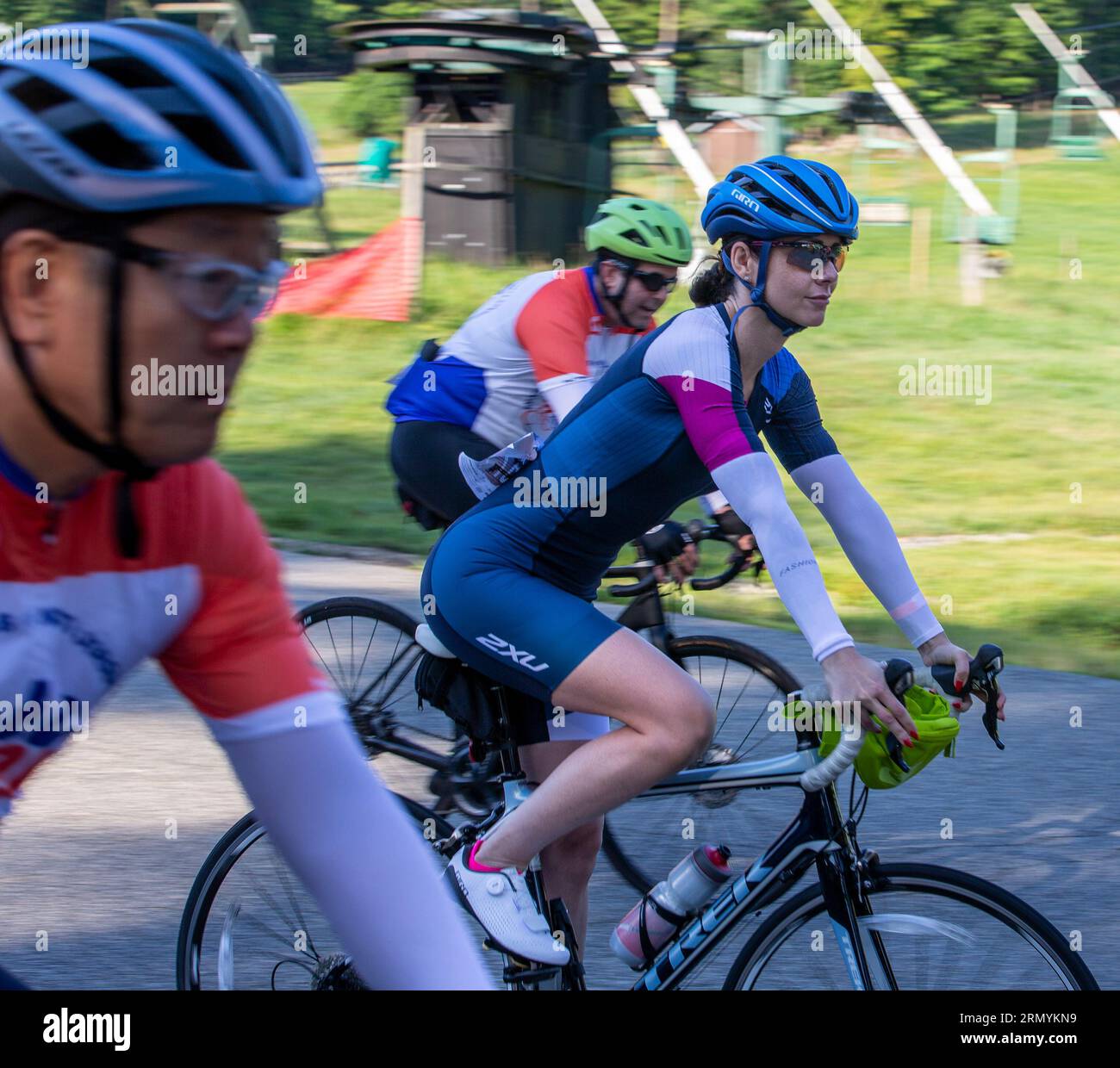 Woman on a road bike at a bicycle rally Stock Photo - Alamy
