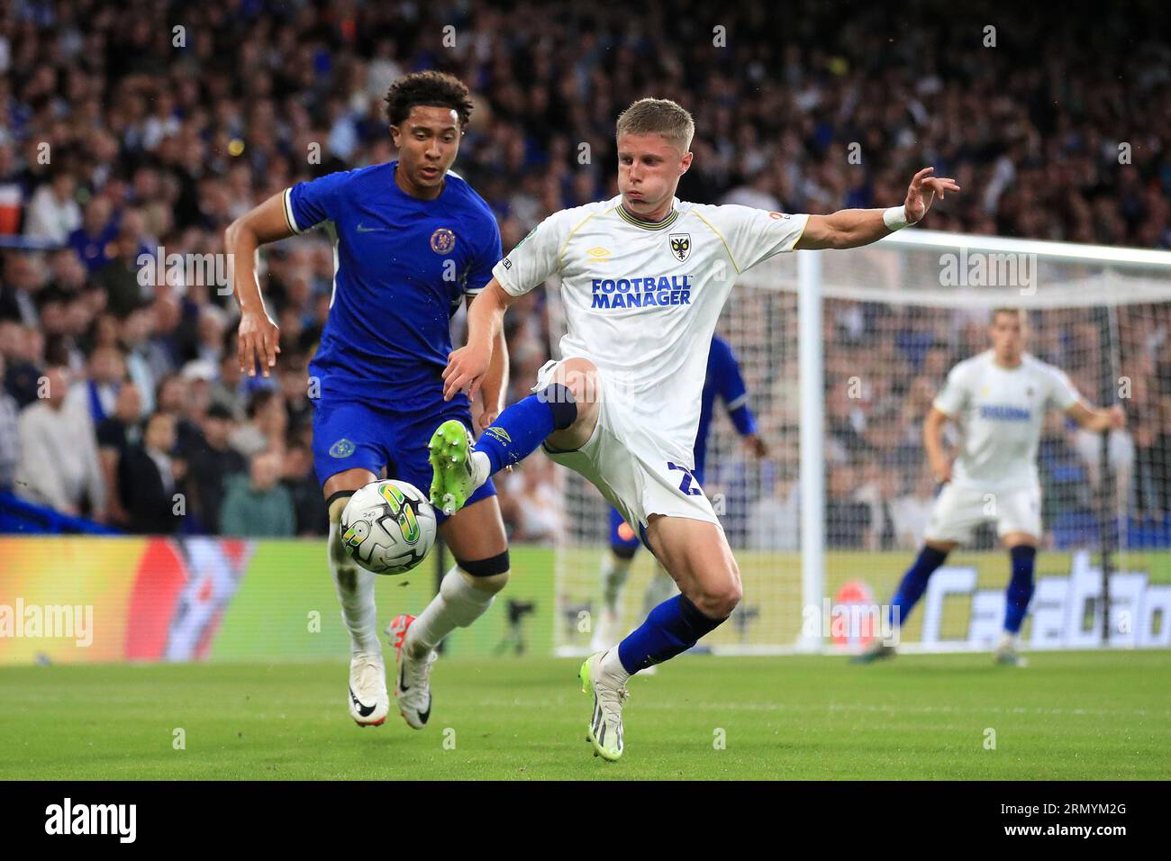 London, UK. 30th Aug, 2023. Morgan Williams of ACF Wimbledon and Bashir Humphreys of Chelsea ...