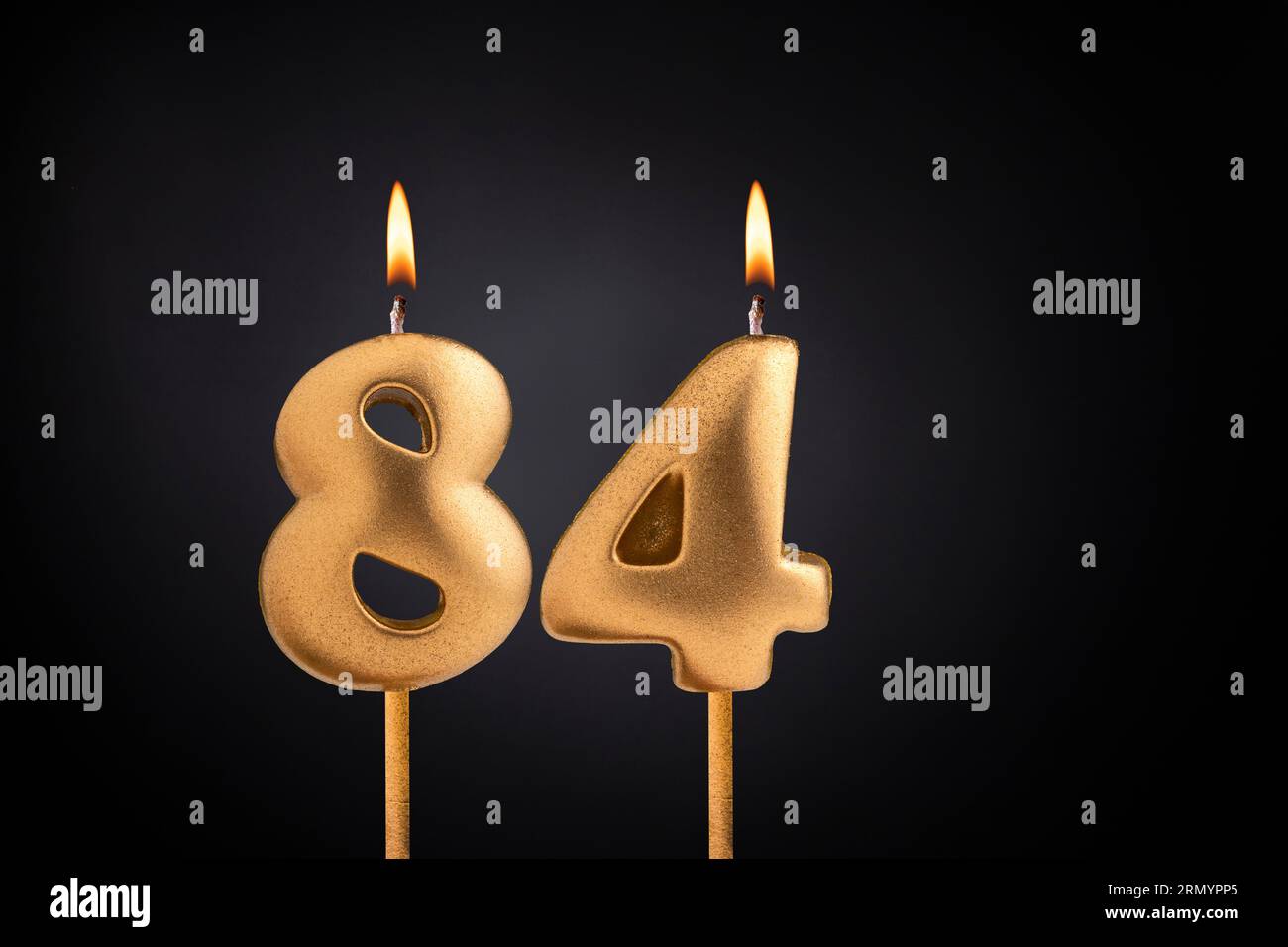 Birthday candle number 84 - Birthday celebration on black background ...