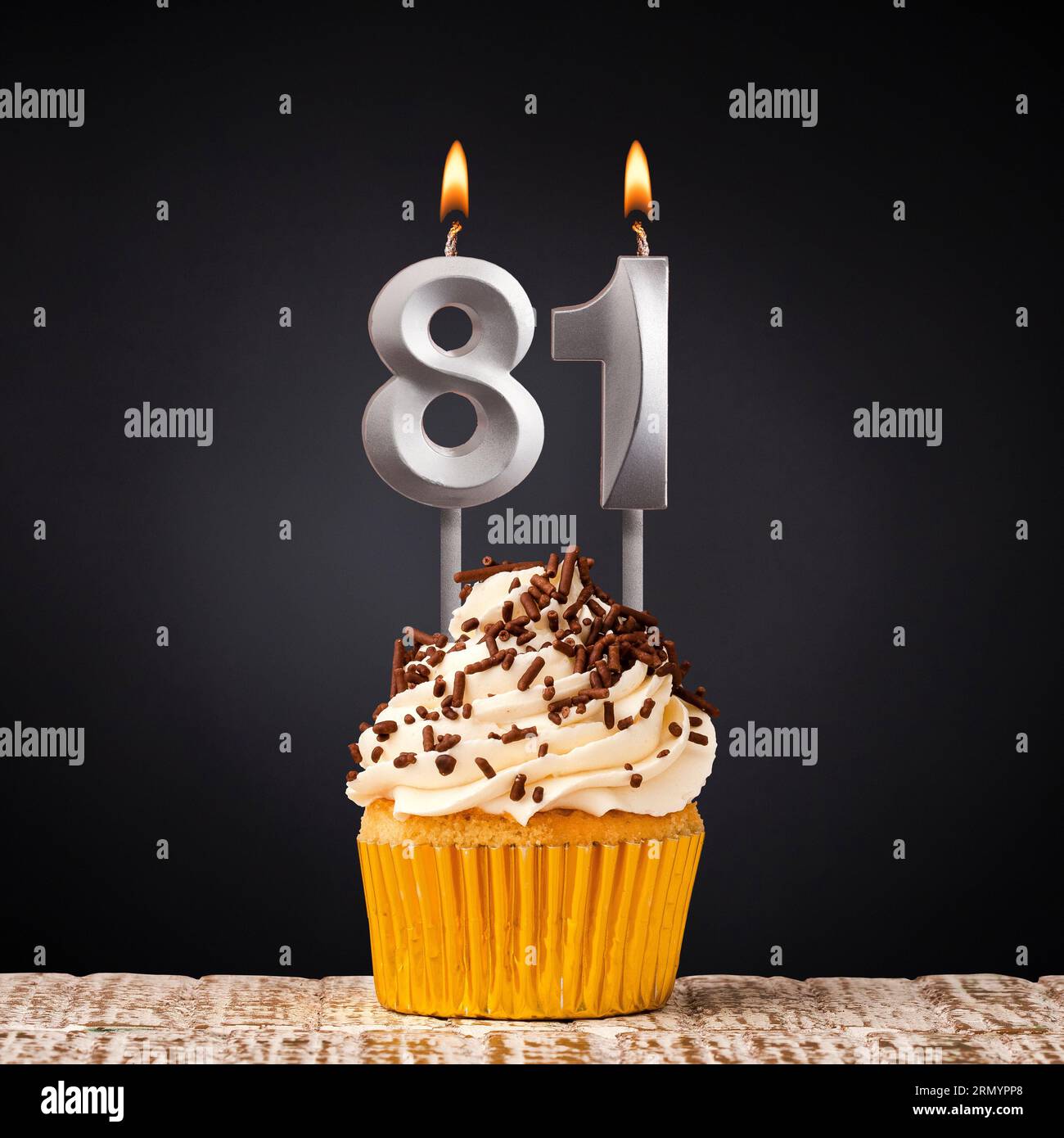 Birthday candle number 81 - Anniversary cupcake on black background ...