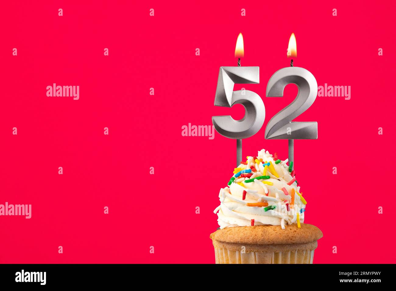 Burning candle number 52 - Birthday card with cake Stock Photo - Alamy