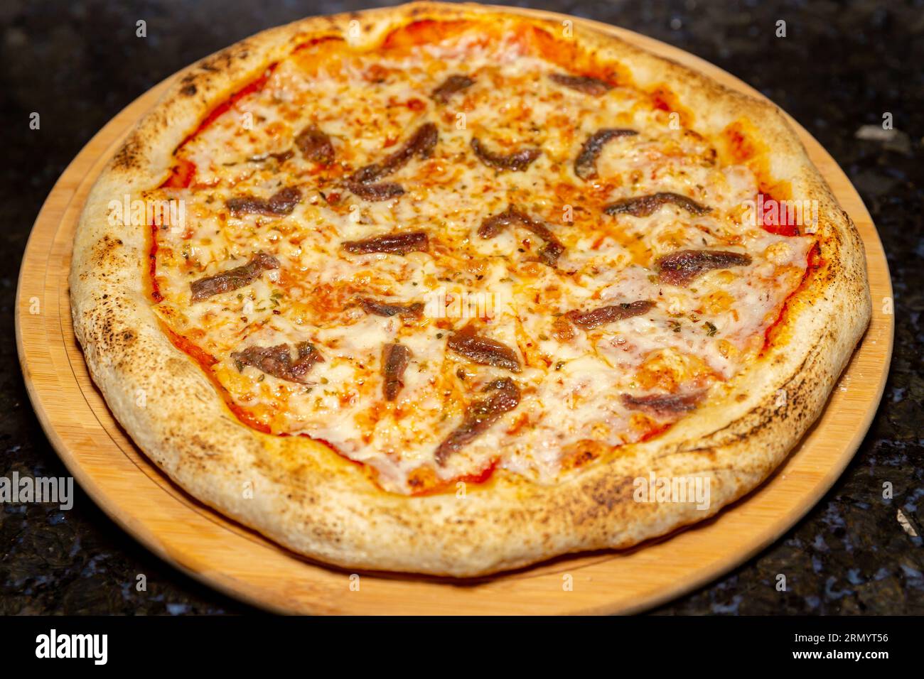 Traditional anchovy pizza (alicci) with artisan long-matured dough ...