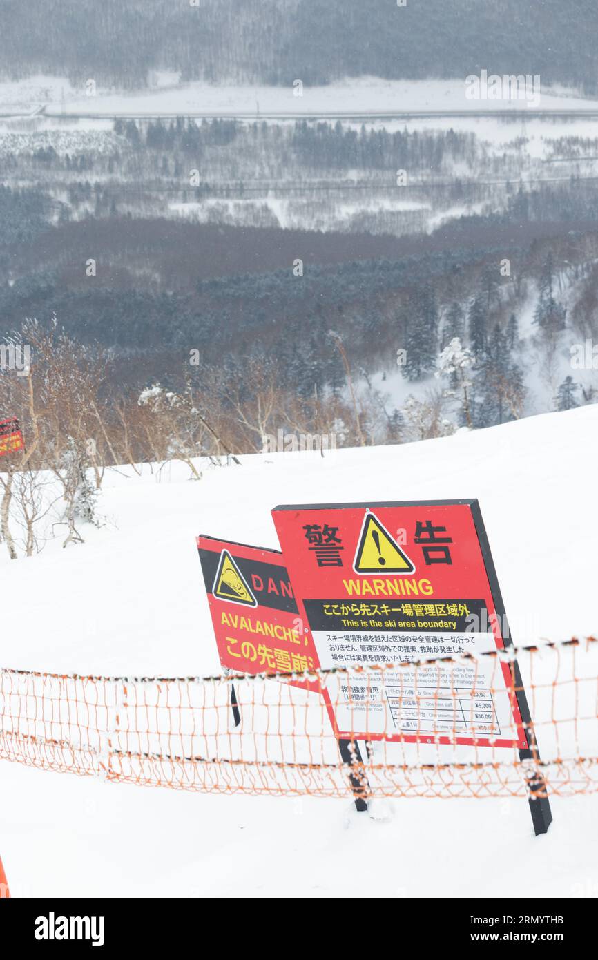 Two off-piste avalanche warning signs at the boundary of a ski resort ...