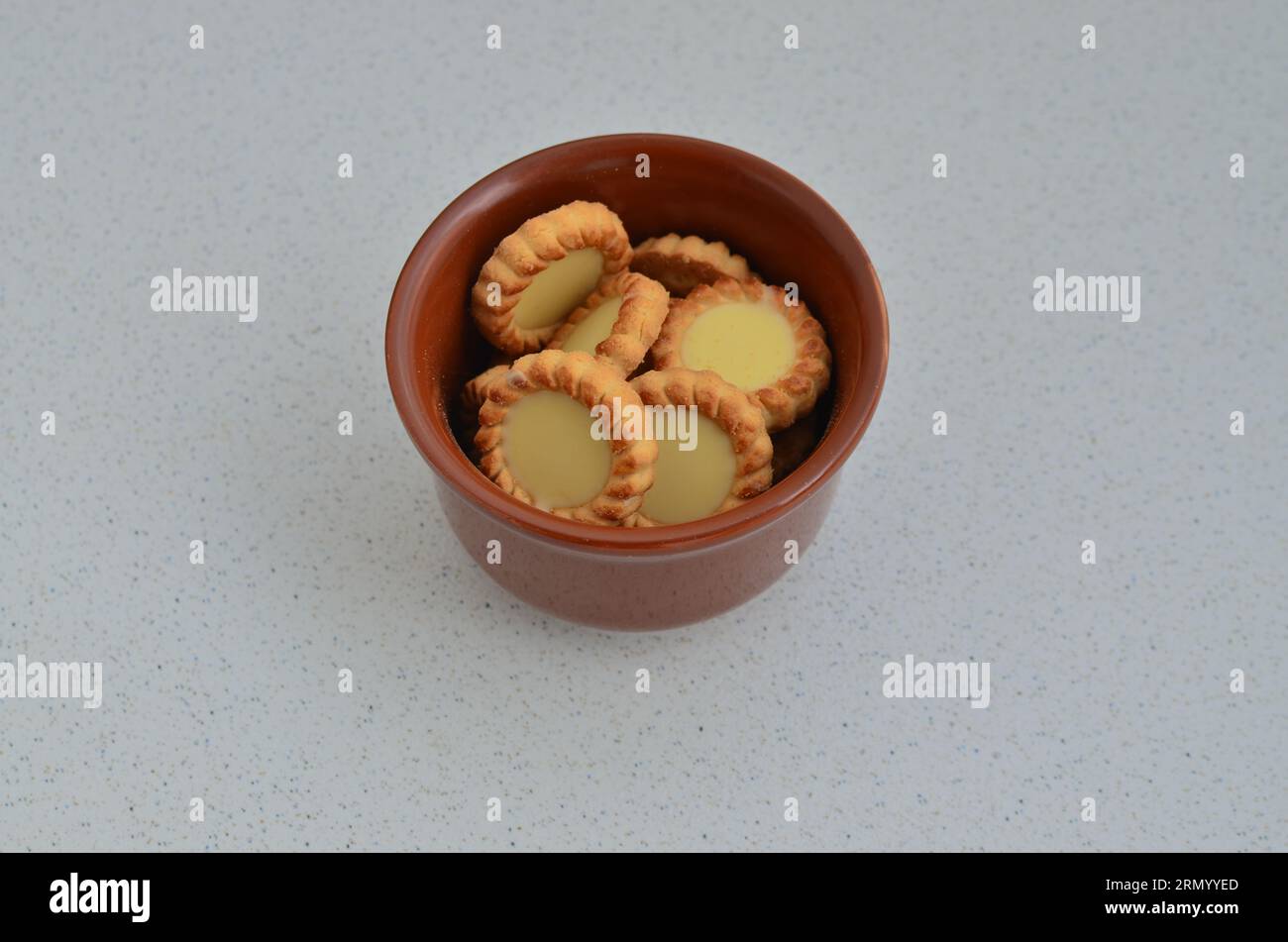 Close-up of delicious biscuits in the form of tartlets filled with ...