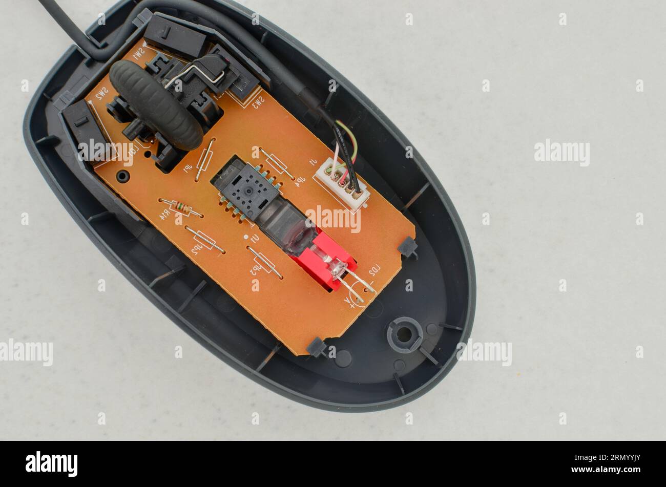 Open computer mouse with exposed electronic circuit for maintenance ...