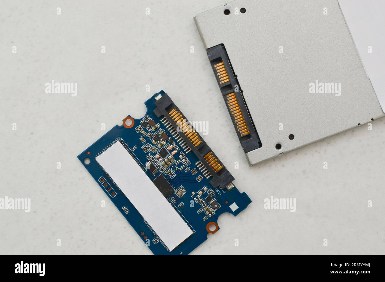 Detail of open SSD with exposed logic board for repair and data ...
