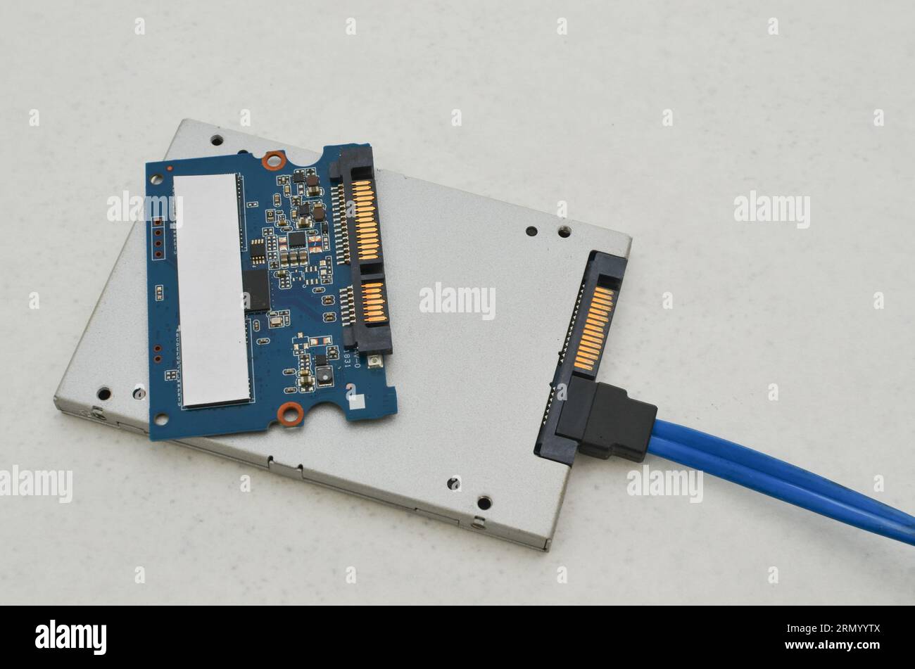 Detail of open SSD with exposed logic board for repair and data ...