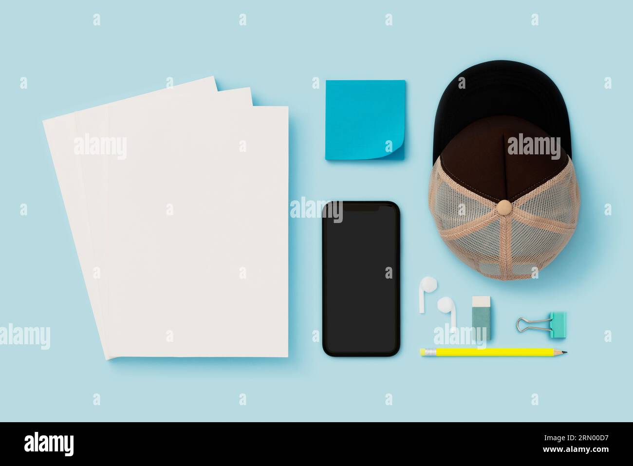 Back to school flat lays on blue background. Blank magazines and ...