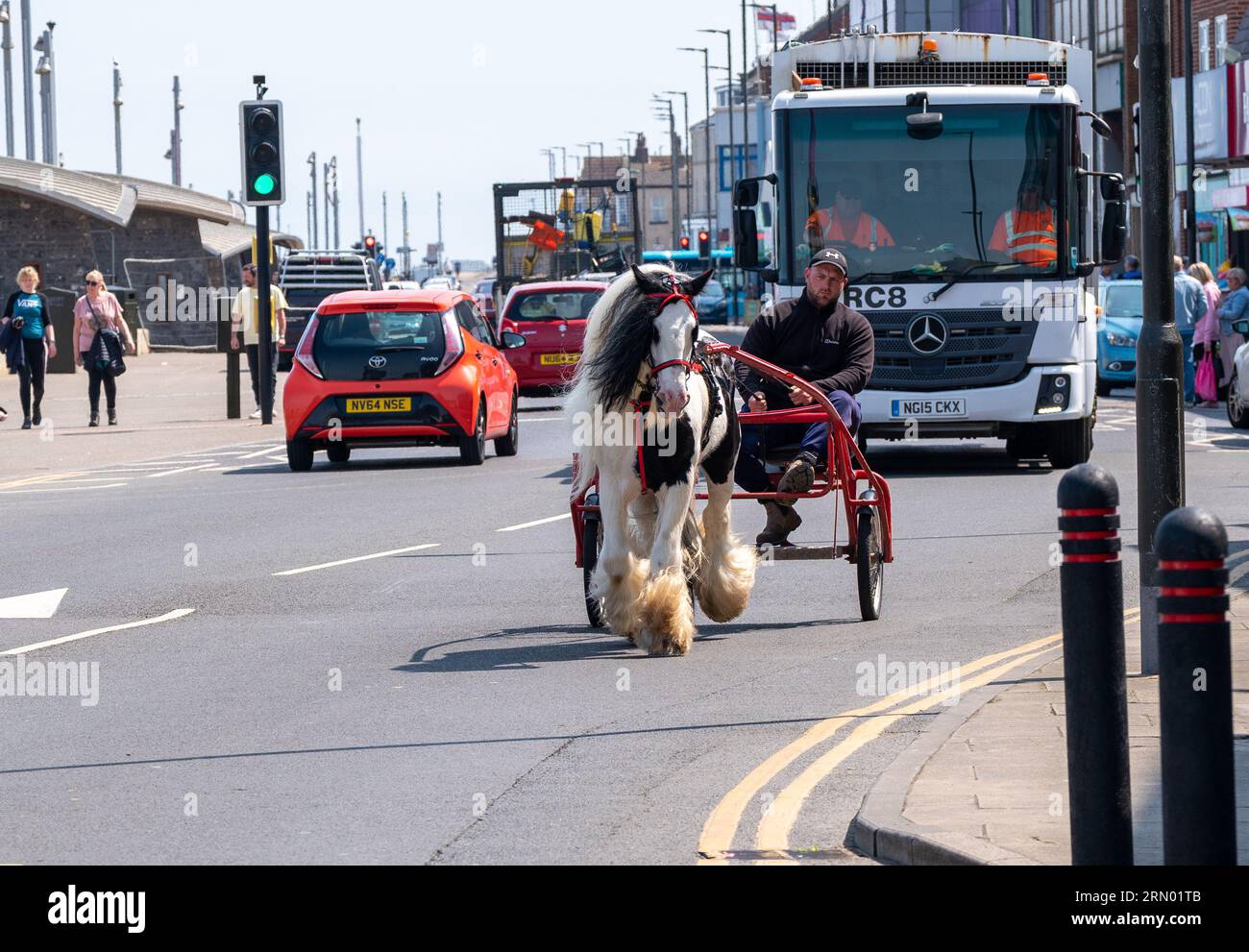 Gypsy rides horse and trap in Redcar UK Stock Photo - Alamy